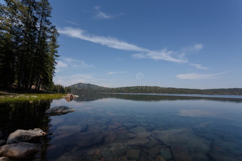 Clear Water of Alpine Lake Shows Rocky Bottom of the Lake Stock Image ...