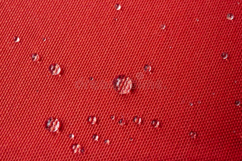Clear Water Drops on Red Canvas Stock Photo - Image of fabric, bright ...
