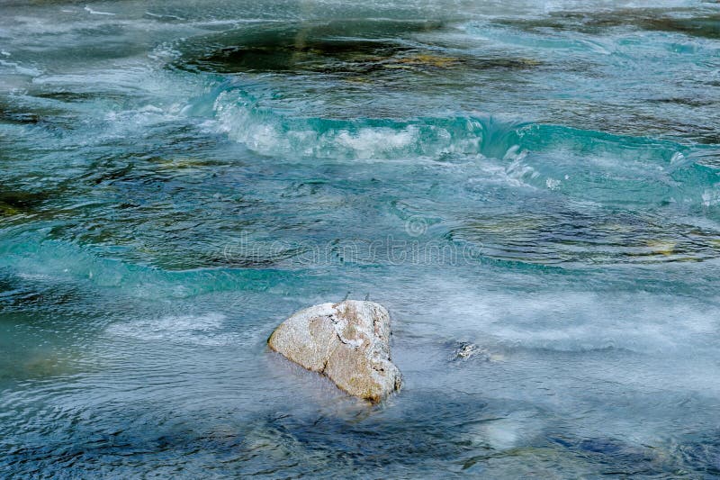 Clear Water Flows Around a Solitary Rock in a Tranquil River Setting ...