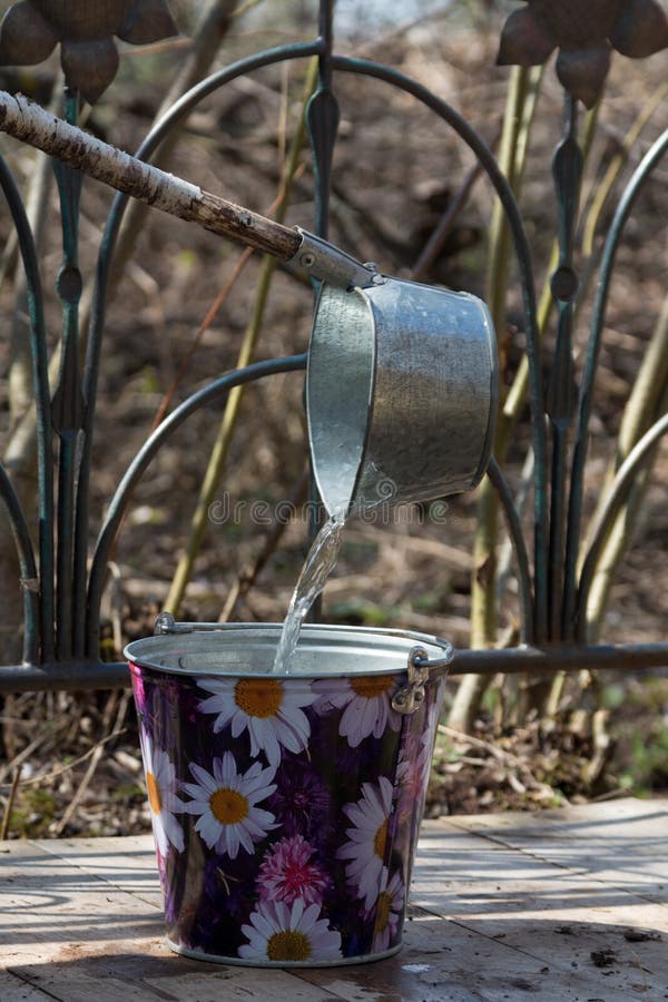 Water Pouring in Bucket stock photo. Image of conserving - 30847254