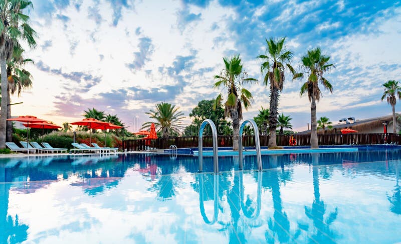 Clear Water of a Luxurious Swimming Pool with Reflection of Blue Cloudy ...