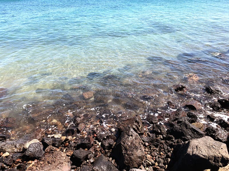 Clear water and rocks stock image. Image of ocean, clear - 179881589