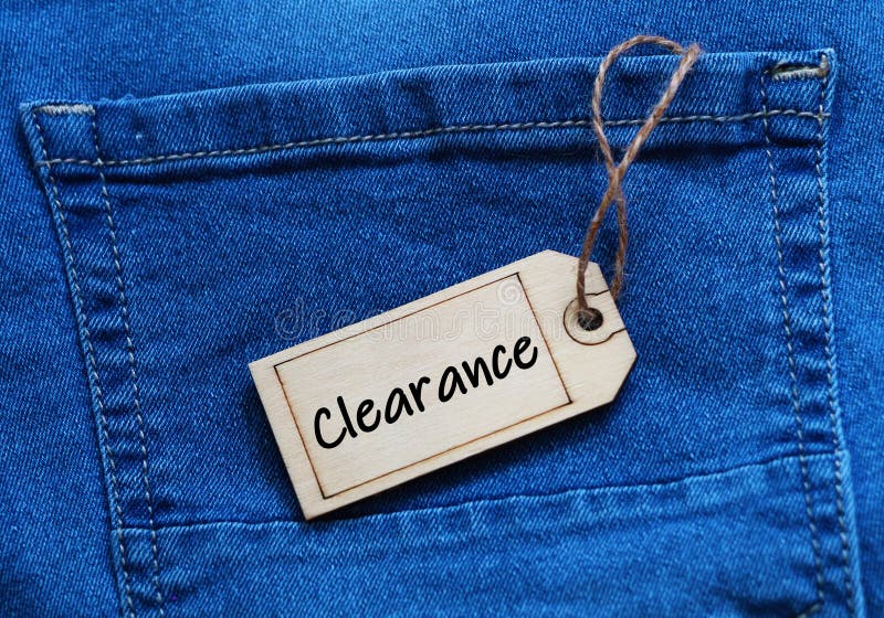 Clearance Tag on Blue Jean Background. Stock Image - Image of sales ...