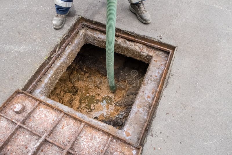 Clearing the Cresspool with a Gut Stock Photo - Image of sewage, open ...