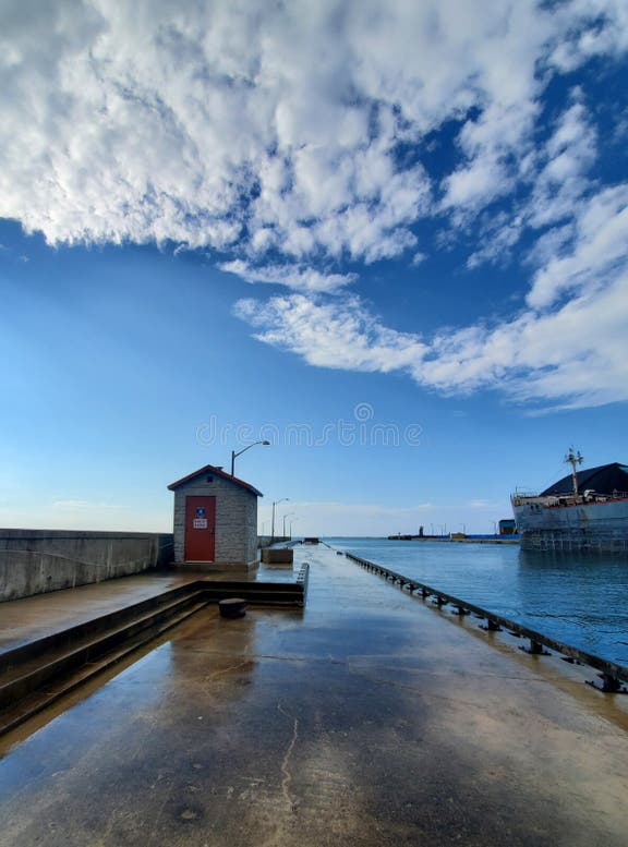 Clearing at Goderich Pier stock photo. Image of clouds - 237693838