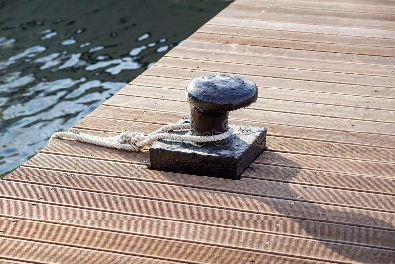 Metal Cleat for Mooring Boats, Bolted To the Ground, with Rope and ...