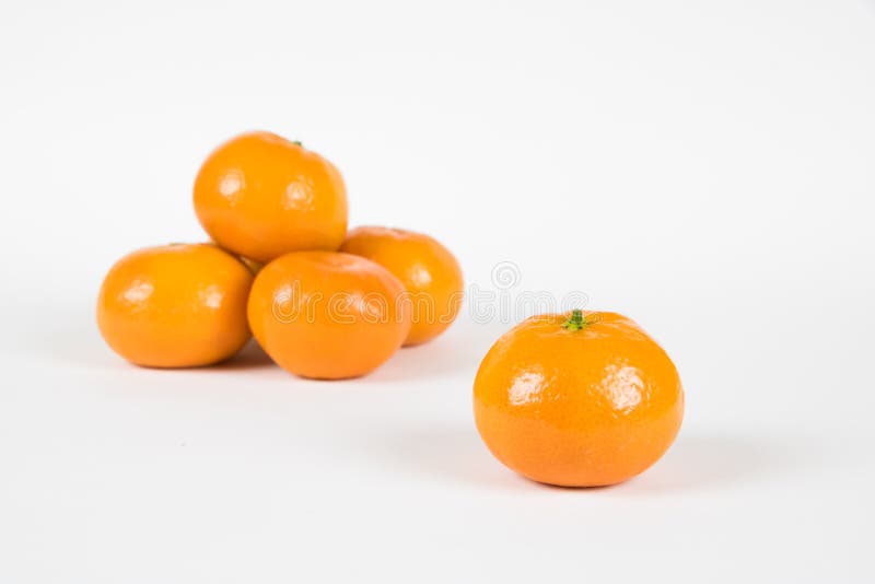 Clementine Separated from Small Pile on White Stock Image - Image of ...