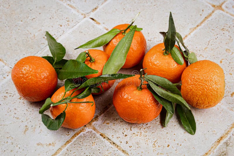 Clementines with Leaves in Close-up on a Table Stock Image - Image of ...