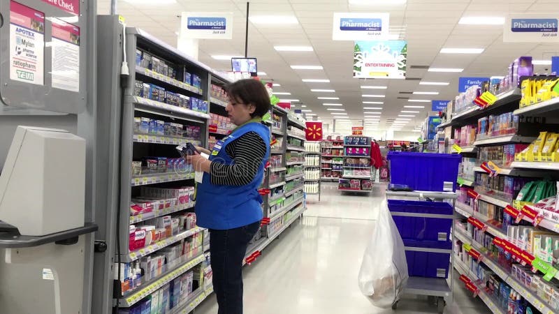Clerk Stocking Medicine on Shelf at Pharmacy Section Stock Footage ...