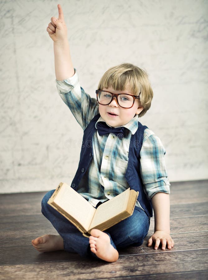 Clever boy reading a novel stock image. Image of education - 54273769