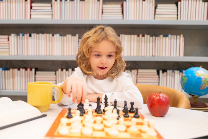 Clever Concentrated and Thinking Child Playing Chess. Stock Photo ...
