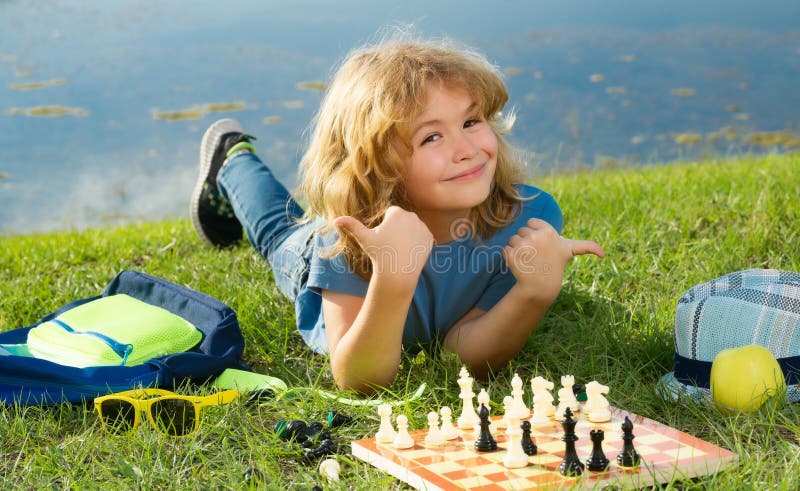 Clever Concentrated and Thinking Child Playing Chess. Stock Photo ...