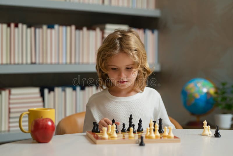 Clever Concentrated and Thinking Child Playing Chess. Stock Photo ...