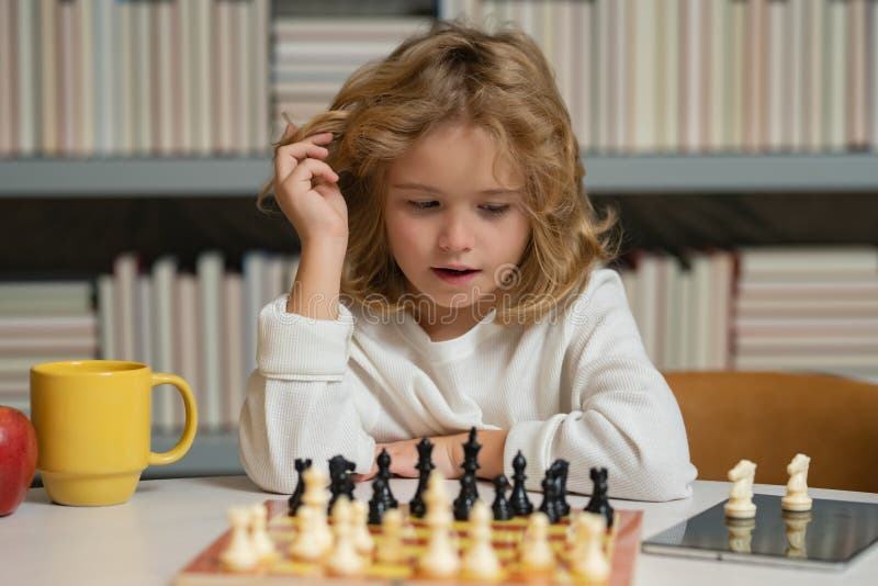 Clever Concentrated and Thinking Child Playing Chess. Stock Image ...