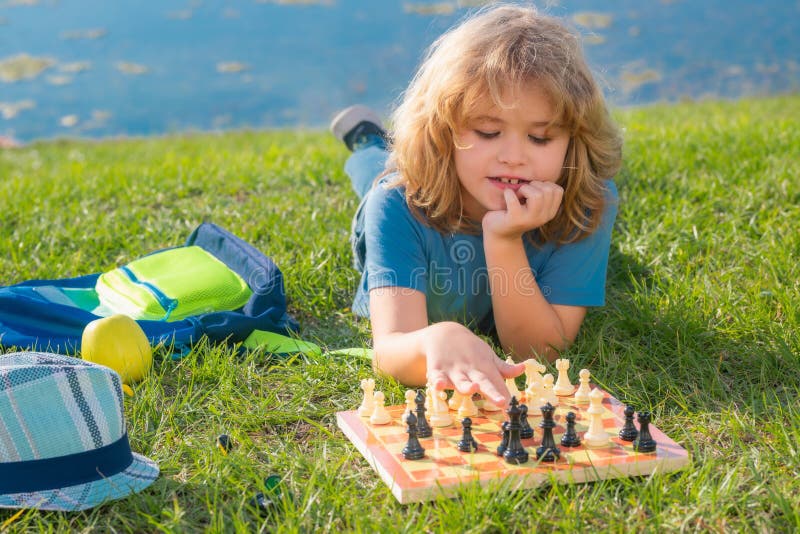 Clever Concentrated and Thinking Kid Boy Playing Chess. Stock Image ...