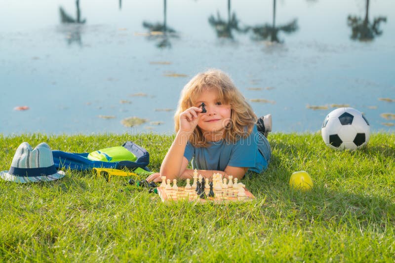 Clever Concentrated and Thinking Kid Boy Playing Chess. Stock Photo ...