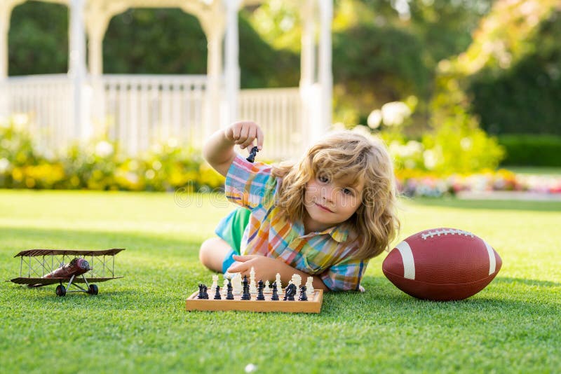 Clever Concentrated and Thinking Kid Boy Playing Chess. Stock Photo ...