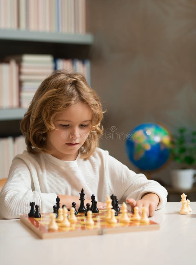 Clever Concentrated and Thinking Kid Boy Playing Chess. Stock Image ...