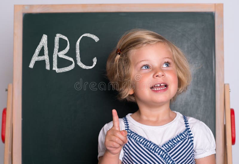 Clever Girl in Front of Black Board Stock Photo - Image of class ...