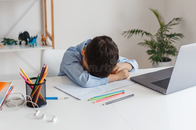 Clever Kid Tired To Learn Difficult Homework Using Laptop and Internet ...