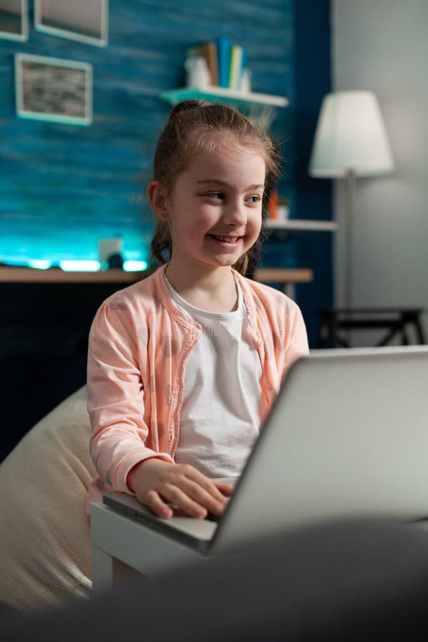 Clever Smiling Schoolkid Working at Literature Homework Browsing ...