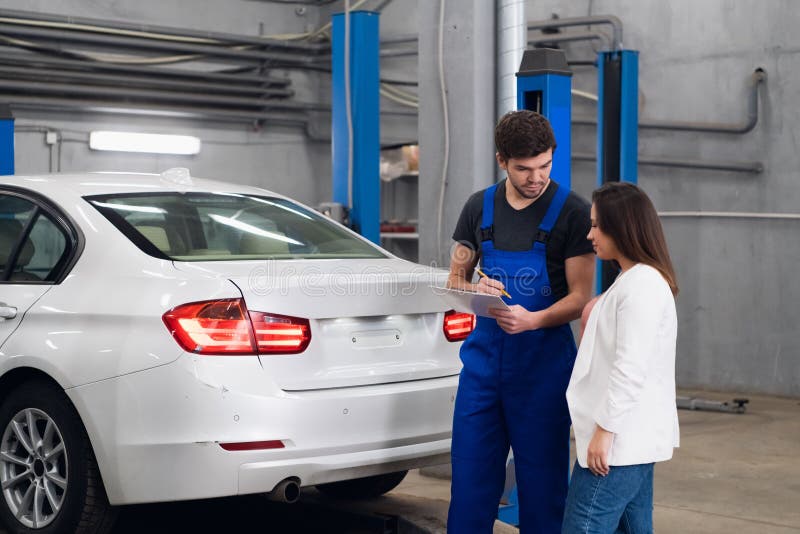 A Client Asks a Mechanic about a Car Repair Stock Image - Image of ...