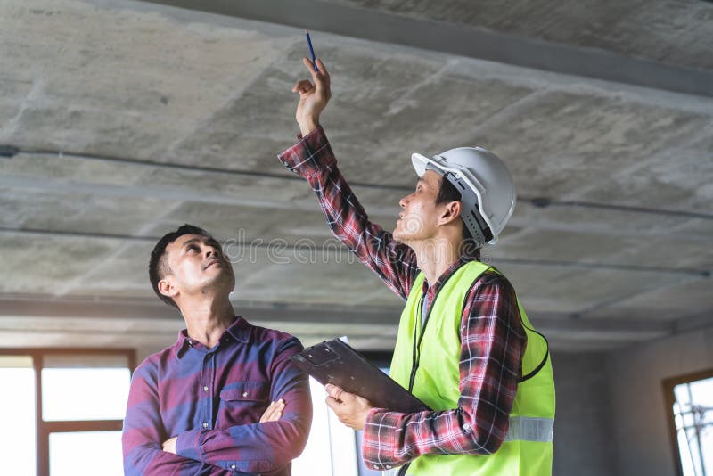 Client and Contractor Discussing Plan To Renovation House Stock Image ...