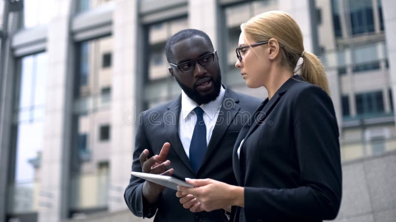 Client and Executive Discussing Details of Project on Tablet, Business ...