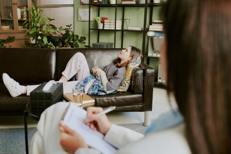 Counseling Session with Client Laying on Couch Stock Image - Image of ...