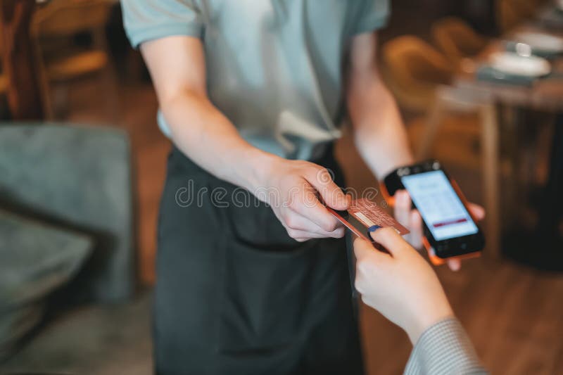 Customer Uses Contactless Payment with Credit Card at a Restaurant ...
