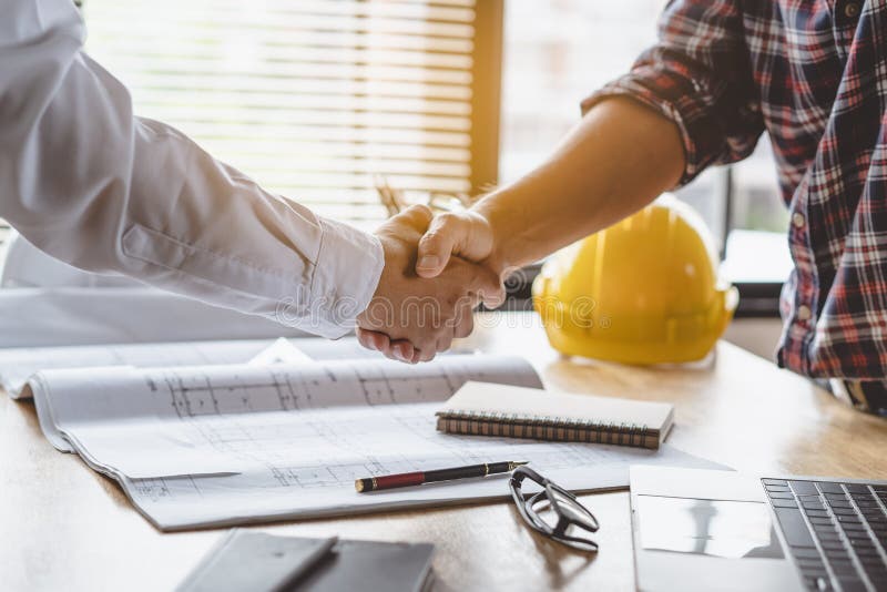 Client Shaking Hands with Contractor after Confirm Blueprint To ...