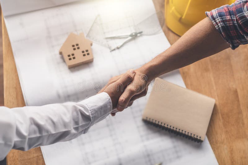 Client Shaking Hands with Contractor after Confirm Blueprint To ...