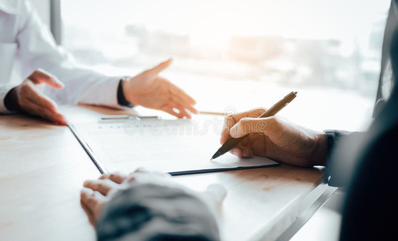 Client Signing a Real Estate Contract on Desk in Office. Stock Image ...