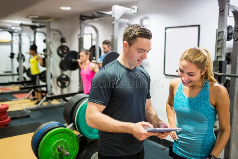 Client and Trainer Looking at Tablet Pc Stock Image - Image of activity ...