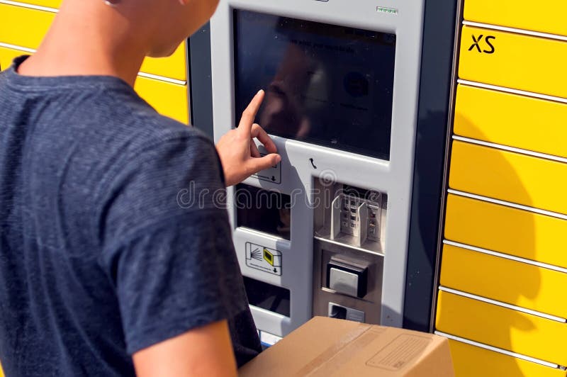 Client Using Automated Self Service Post Terminal Machine or Locker To ...