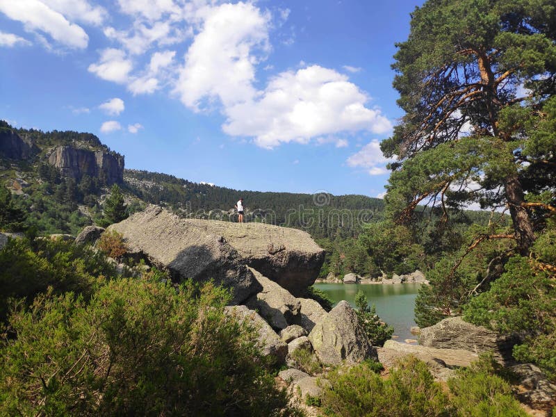 Clif with a Lake Surounded by Trees Stock Image - Image of trees, lake ...