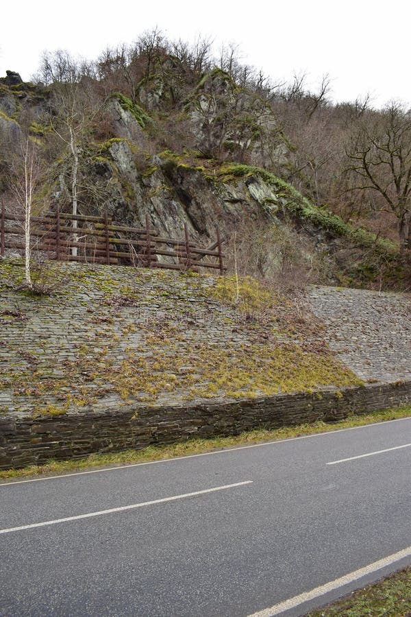 Crumbling cliff in winter stock image. Image of barriers - 350383537