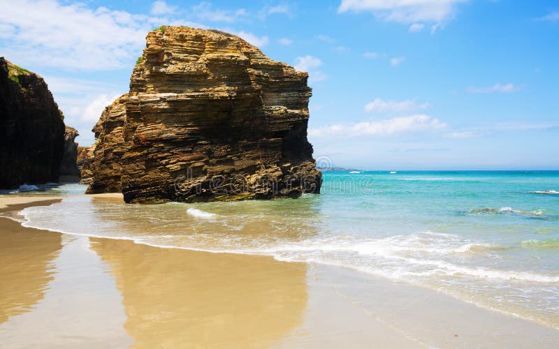 Cliff at beach in summer stock image. Image of galician - 60705879