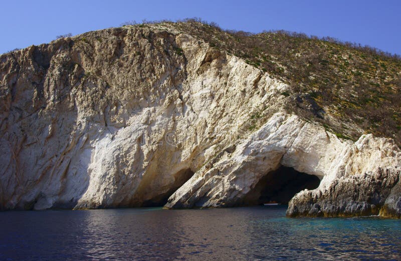 Cliff with cave stock photo. Image of blue, people, greece - 23096522