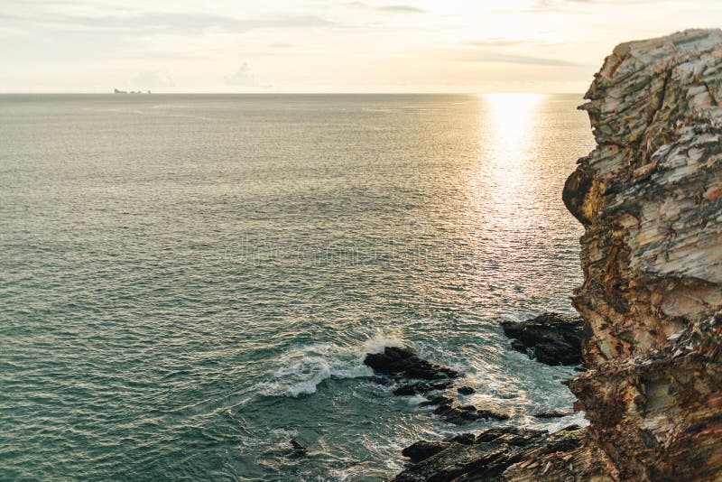 Cliff and Coast with Calm Sea and Cloudy Sky. Stock Image - Image of ...