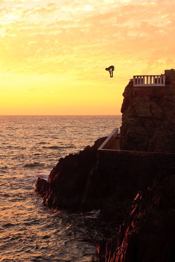 Cliff Diver Off the Coast of Mazatlan at Sunset Stock Photo - Image of ...
