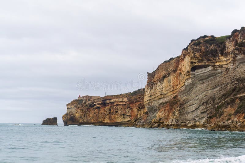 The Cliff in Nazare, Where the Most Famous Lighthouse in the World is ...