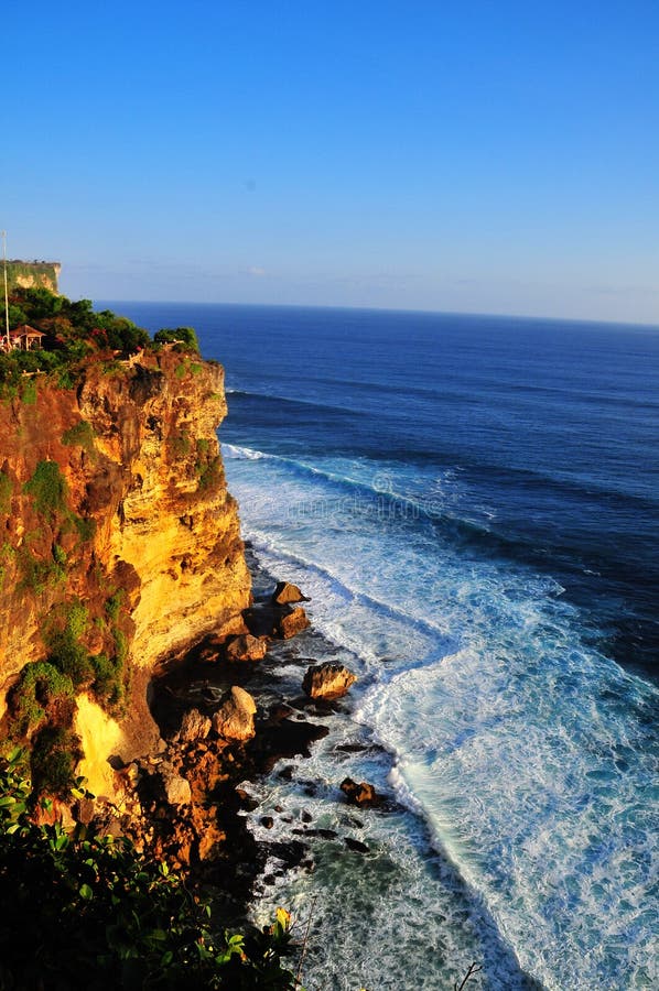 Cliff Near the Sea Under Sunset Stock Photo - Image of peaceful, bali ...