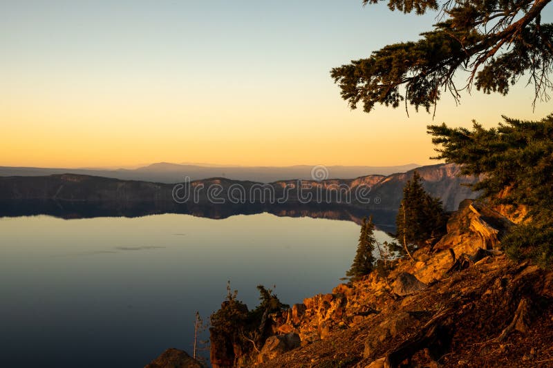 Cliff Over Crater Lake Glows Orange at Sunset Stock Image - Image of ...