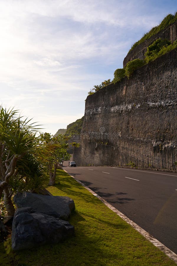 The Cliff Overhangs Along the Road To the Ocean at Sunset Stock Image ...