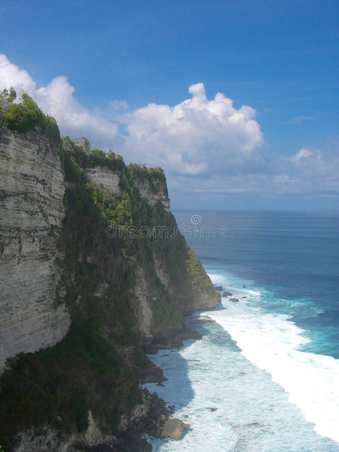 Cliff with the sea at BAli stock image. Image of holiday - 125471787