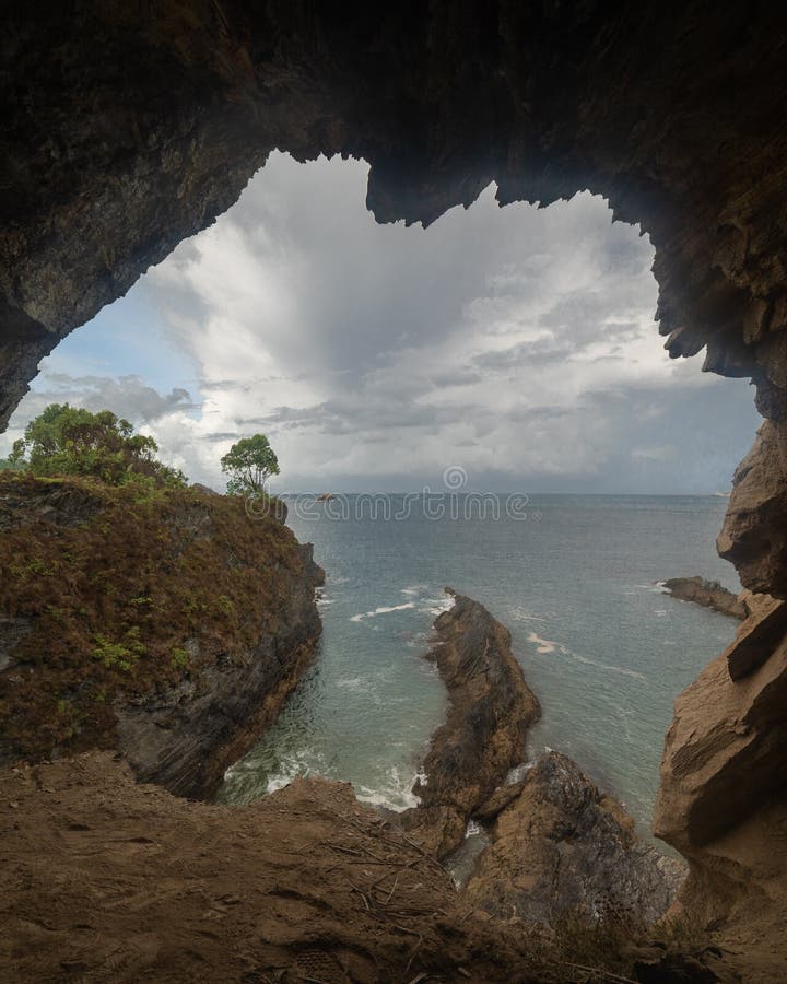 A Cliff Seen from Inside a Cave Stock Image - Image of water, inside ...