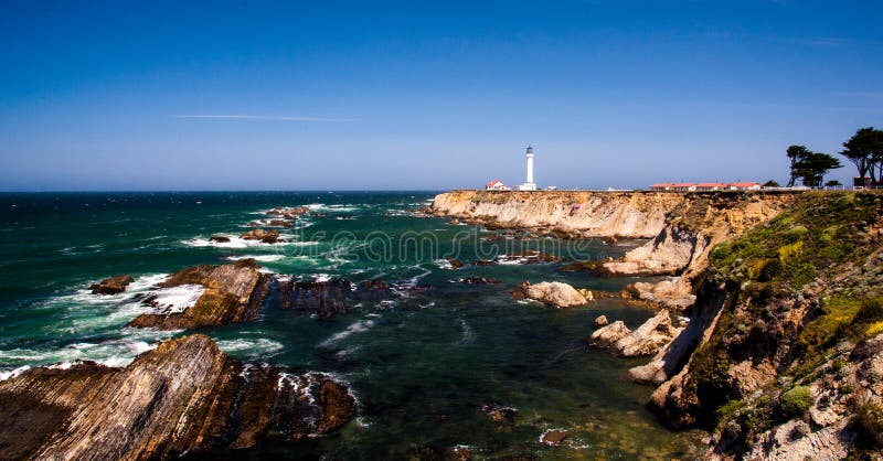 Cliff side lighthouse stock image. Image of flash, boat - 49568739