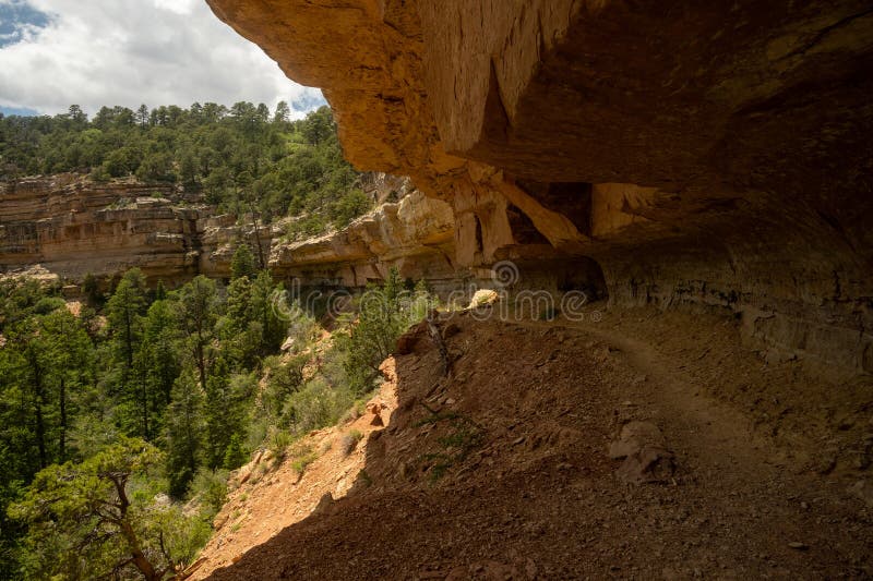 A Man on Top of a Cliff in the Spring Mountains at Sunset and Enjoying ...
