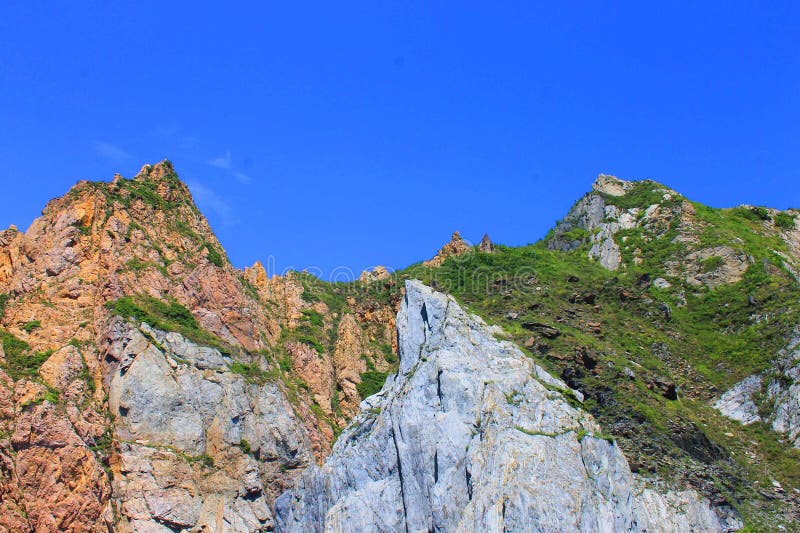 Cliff with vegetation stock photo. Image of sunny, seaside - 97783942